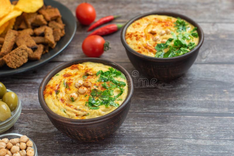 Classic Hummus in Bowls on Wooden Table Stock Photo - Image of paste ...