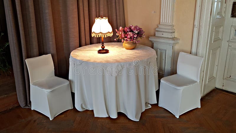Classic Interior of Two Chairs and Table with Table Lamp and Flowers in ...