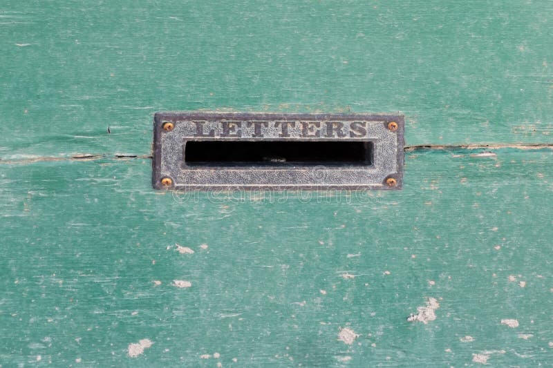 Classic mail slot in door stock photo. Image of nail - 318100576
