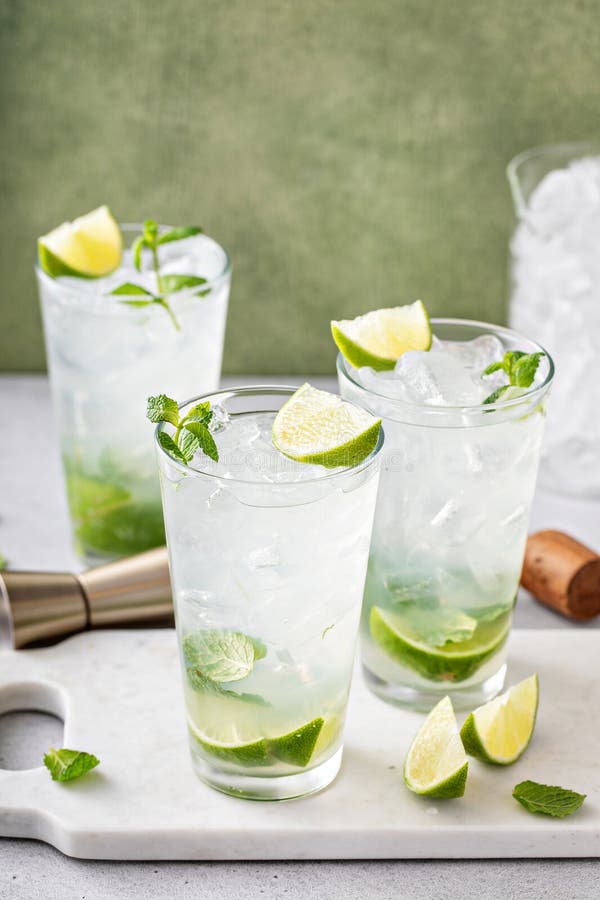 Classic Mojito Cocktail in Tall Glasses with Lime and Mint Stock Image ...