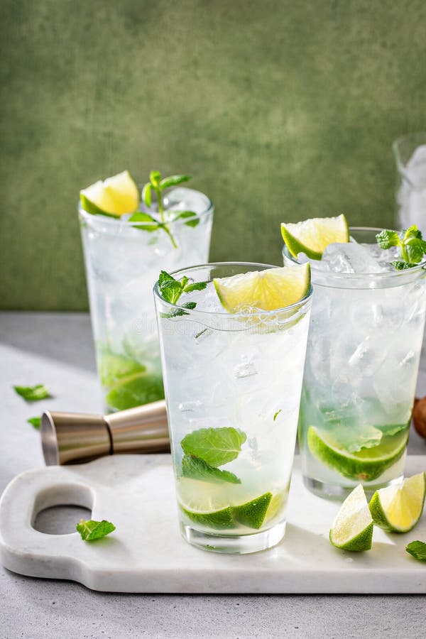 Classic Mojito Cocktail in Tall Glasses with Lime and Mint Stock Image ...