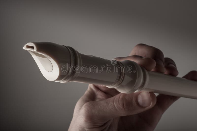 Classic Musical Instrument Flute in Hand on Black Background Stock ...