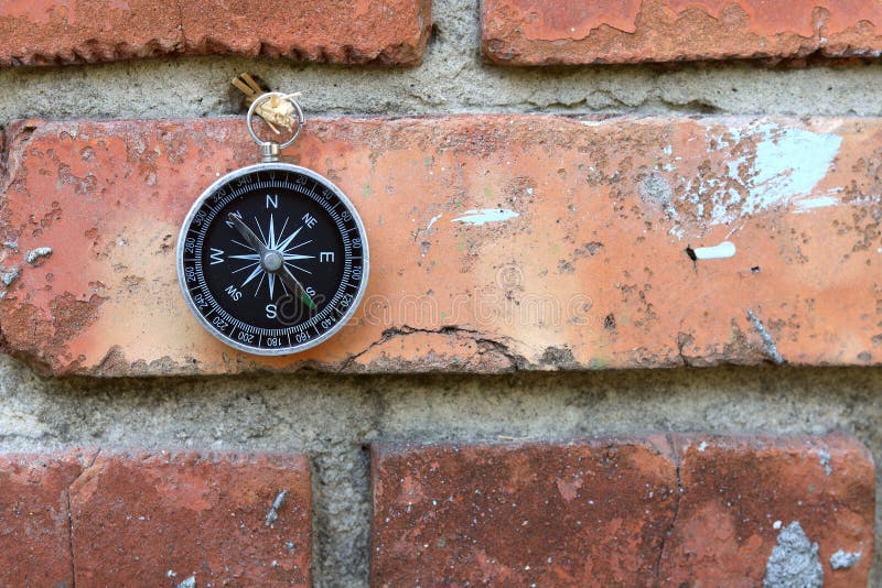Classic Navigation Compass on Brick Wall Background As Symbol of ...