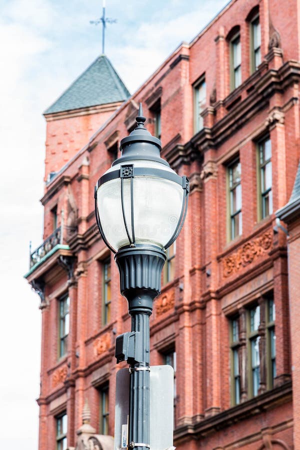 Classic Old Lamp Post by Brick Building Stock Photo - Image of building ...