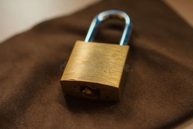 Classic Padlock Closed, Vintage-looking Style, with a Brown Cloth Under ...