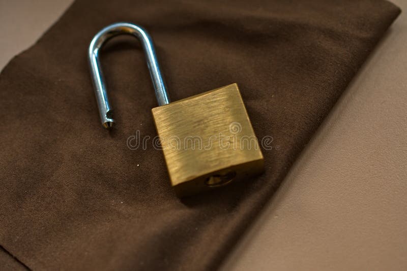 Classic Padlock Closed, Vintage-looking Style, with a Brown Cloth Under ...