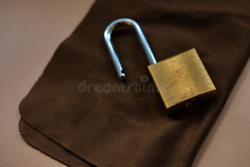 Classic Padlock Open, Vintage-looking Style, with a Brown Cloth Under ...