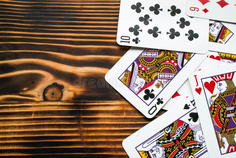 Classic Playing Cards on Dark Brown Wooden Table. Scattered Cards Stock ...