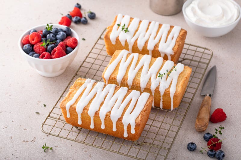 Classic Pound Cake with Powdered Sugar Glaze Dripping Over Stock Photo ...