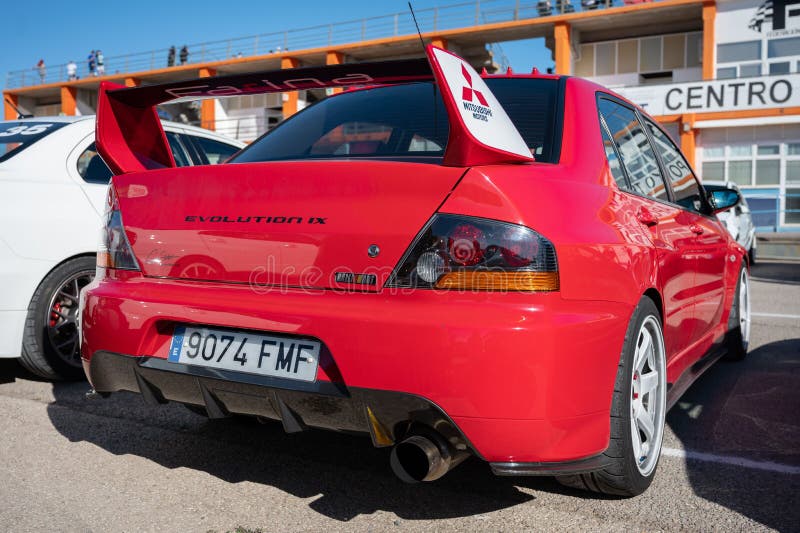 Classic Red Mitsubishi Lancer Evolution IX Parked at an Exhibit ...
