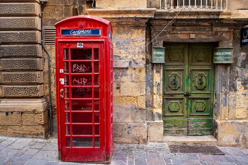 Classic Red Telephone Box in Front of an Old Building. Editorial ...