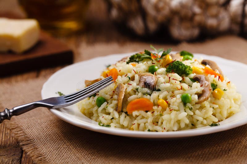 Classic Risotto with Mushrooms and Vegetables Served on a White Plate ...