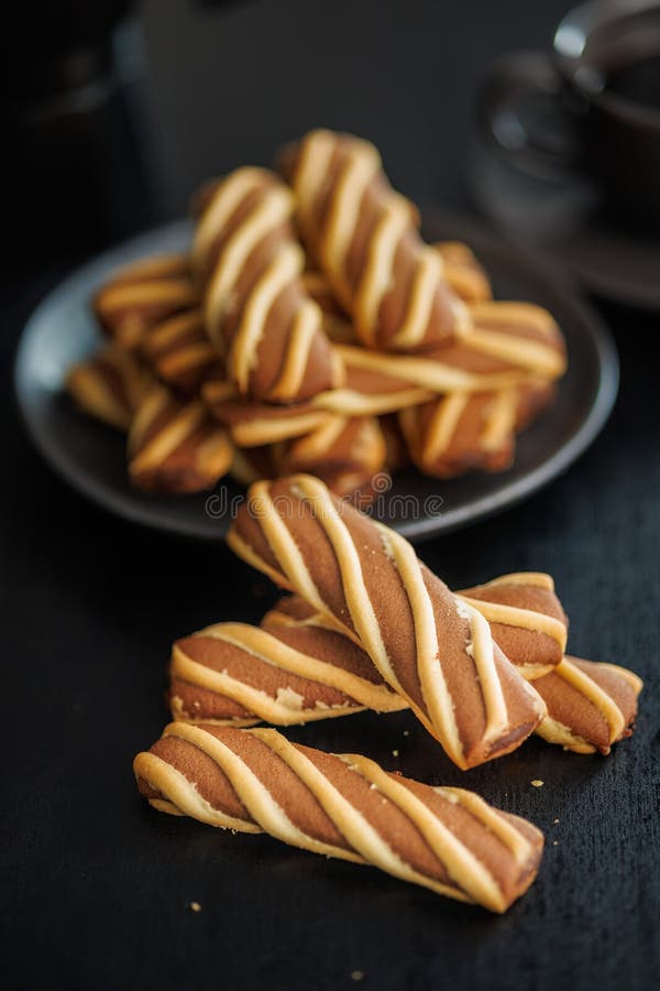 Classic Striped Cookies on Black Table Stock Image - Image of ...