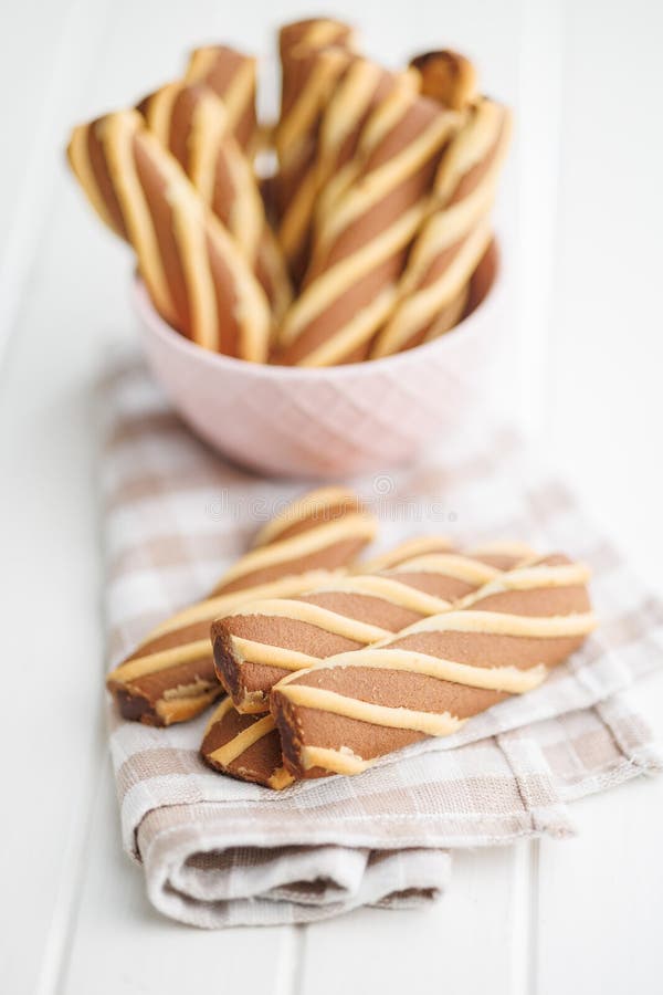 Classic Striped Cookies on Checkered Napkin on White Table Stock Photo ...