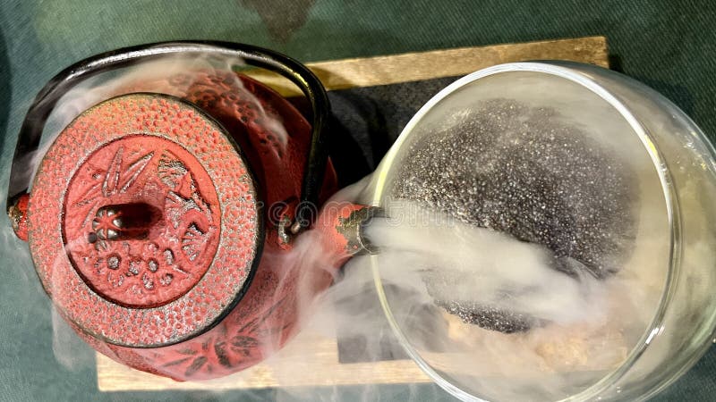 A Classic Teapot with Smoke on a Wooden Table. Stock Image - Image of ...