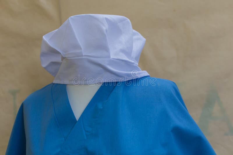 A Classic Typical Chef`s Workwear Suit on a Mannequin. Background with ...