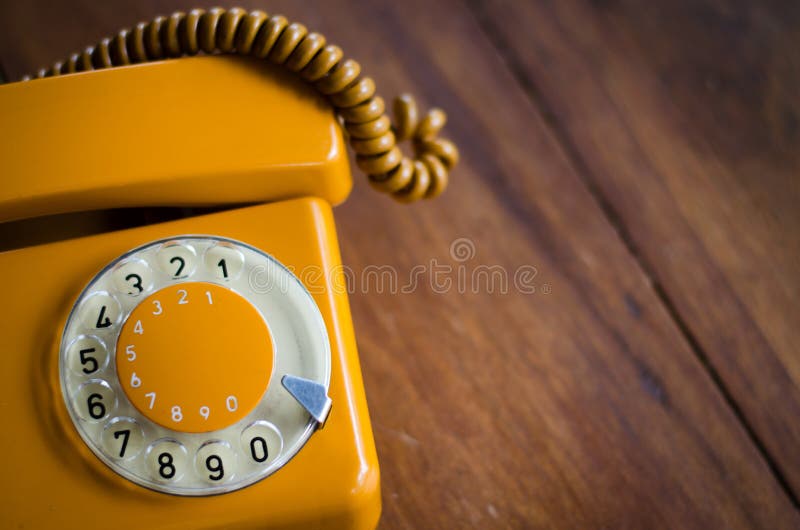 Classic Vintage Yellow Telephone on Wooden Table Stock Photo - Image of ...
