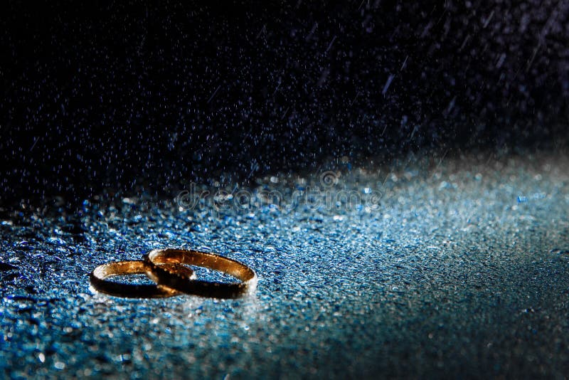 Classic Wedding Rings in a Drop of Water. Stock Photo - Image of judge ...