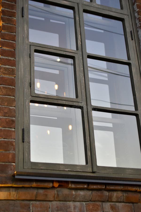 Classic Windows in a Brick House. Beautiful Black Windows in the House ...