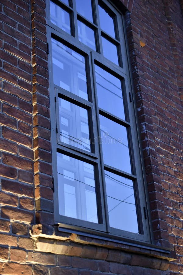 Classic Windows in a Brick House. Beautiful Black Windows in the House ...