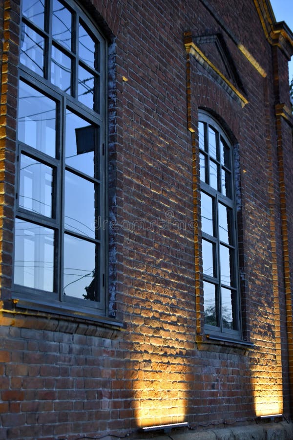 Classic Windows in a Brick House. Beautiful Black Windows in the House ...