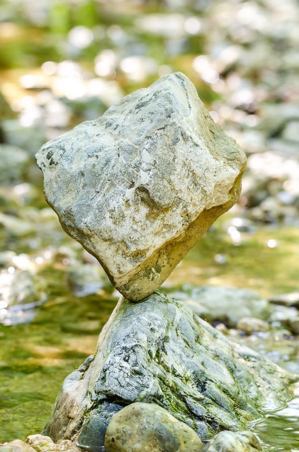 Classical Balanced, Cube Shaped Rock at the Creek Stock Image - Image ...