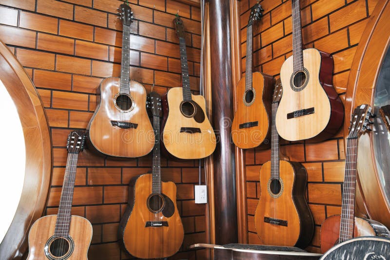 Classical Guitars Hanging on a Wall in a Music Store. Stock Image ...