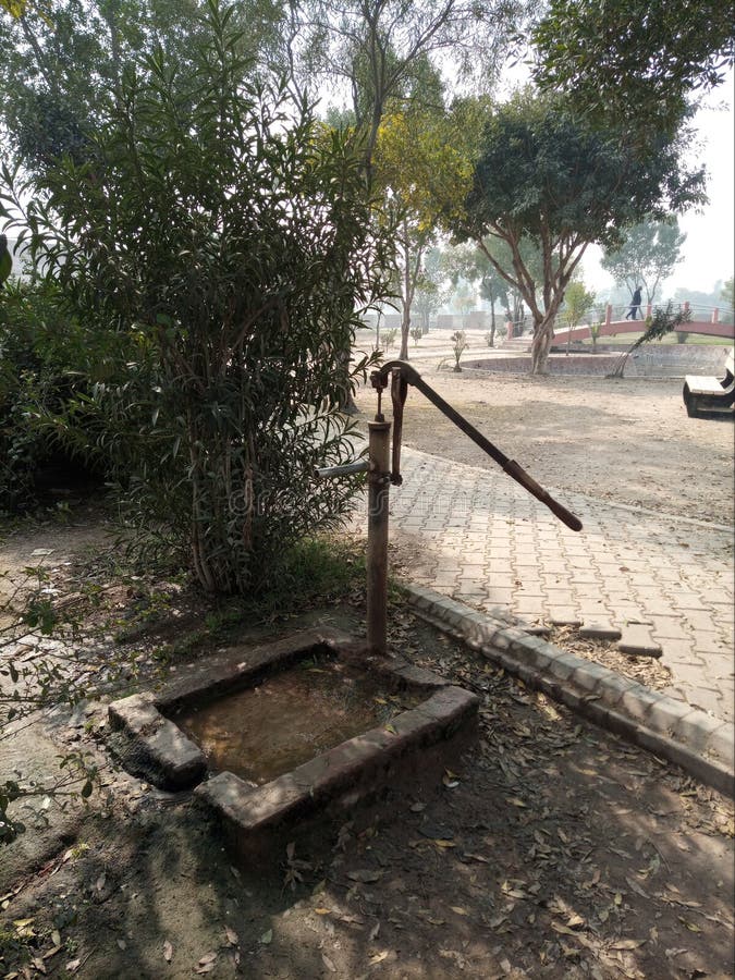 Classical Hand Pump for Fetching Water for Plants in a Community Garden ...