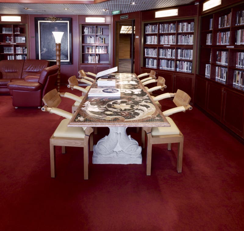 Classical Library Room with Leather Armchairs, Stone Table and World ...