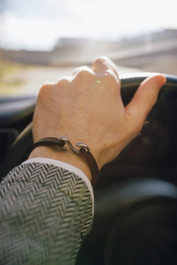 Classical Male Leather Bracelet on a Hand in the Car Stock Image ...