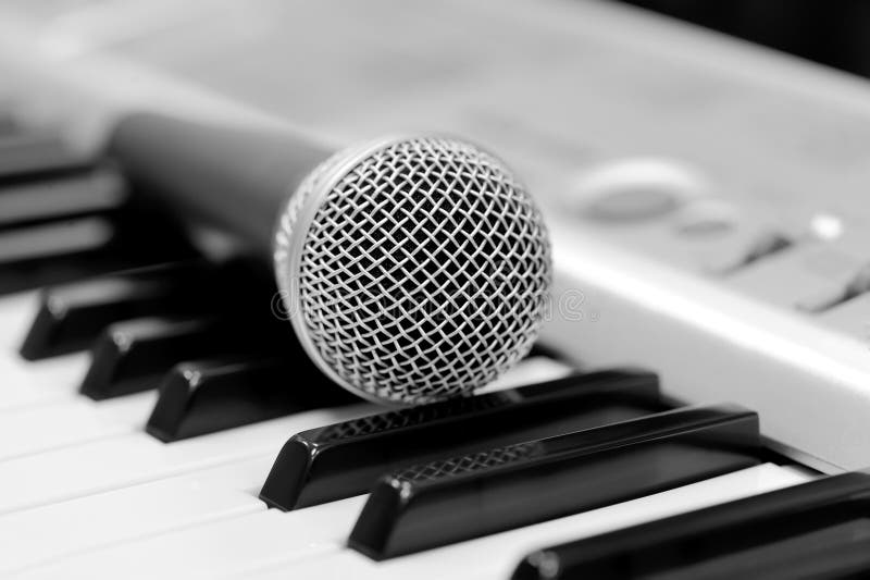Classical Microphone on Keyboard Stock Photo - Image of listening ...