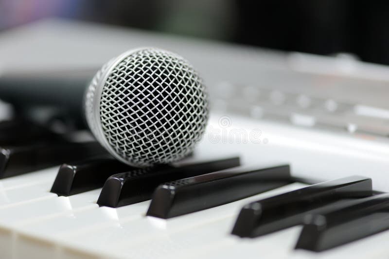 Classical Microphone on Keyboard Stock Photo - Image of learning ...