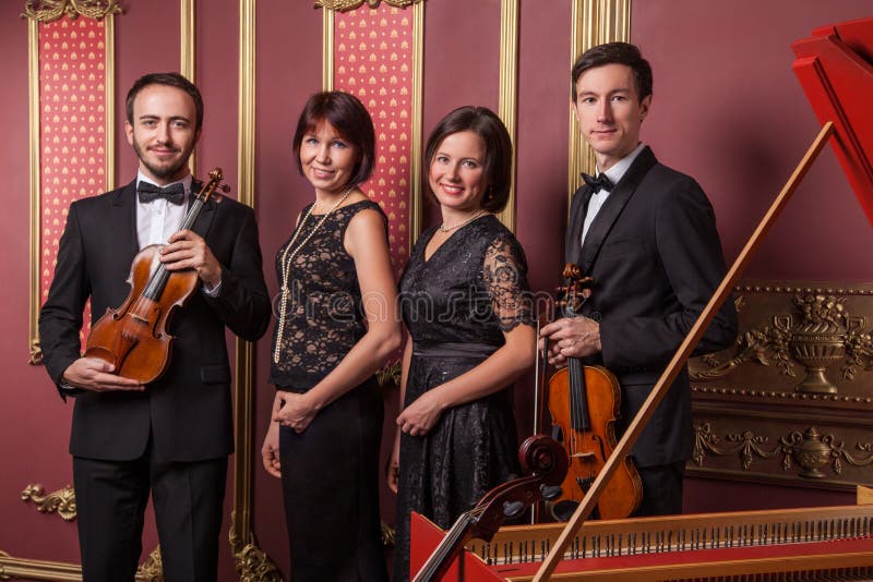 Classical Music Quartet Posing after the Concert. Stock Photo - Image ...