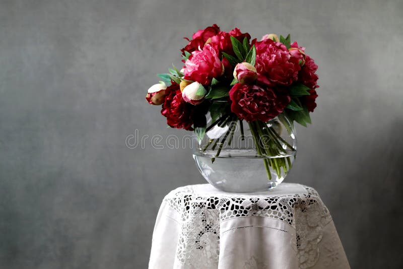 Classical Still Life with Peonies and a Vase Against a Gray Background ...