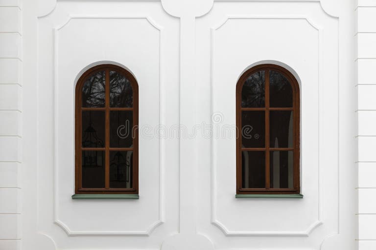 Classical Windows with Arches and Decorative Elements in White Wall ...