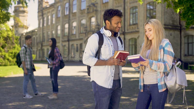 Classmates Communicating on Campus of University after Classes ...