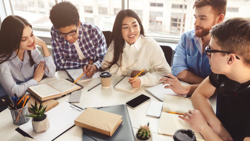 Classmates Doing Their Project Together, Discussing Material Stock ...