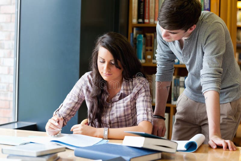 Classmates Helping Each Other Stock Photo - Image of knowledge ...
