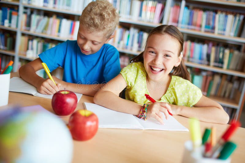 Classmates at lesson stock image. Image of giving, laughing - 34412701