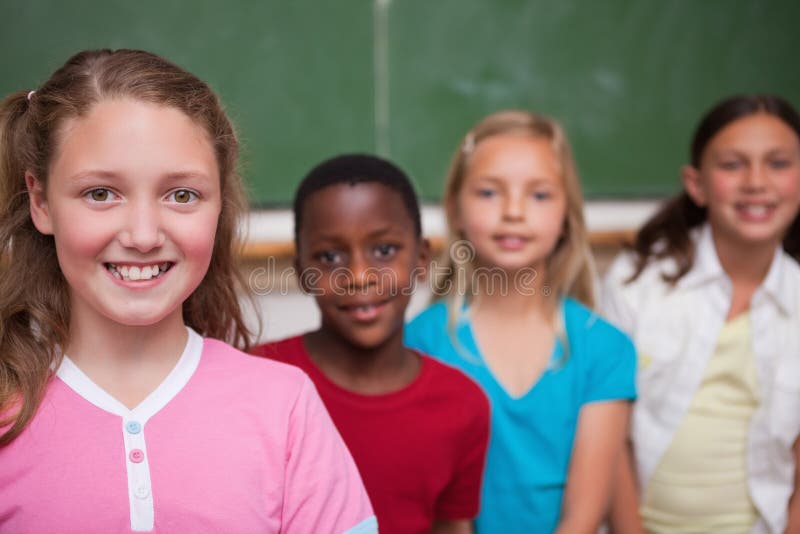 Classmates posing in a row stock photo. Image of board - 22692586