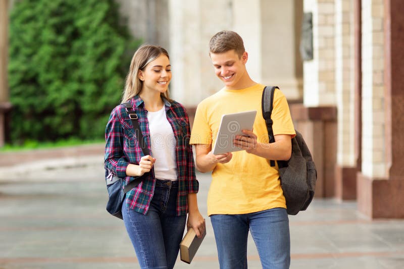 Classmates Preparing for Lecture with Digital Tablet Outdoors Stock ...