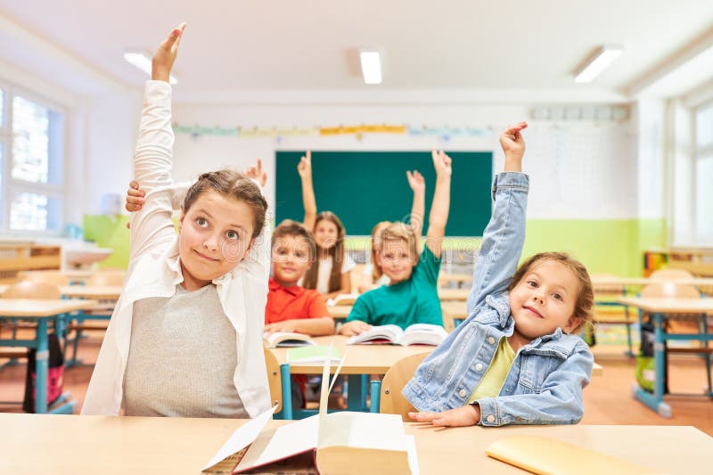 Girls Raising Hands during Lecture in Class Stock Photo - Image of desk ...