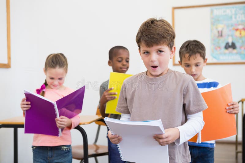 Classmates Reading Notepads Classroom Stock Photos - Free & Royalty ...