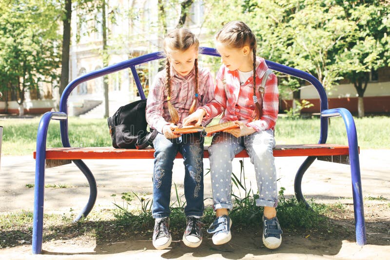 Classmates Sit and Read a Book Stock Photo - Image of book, person ...