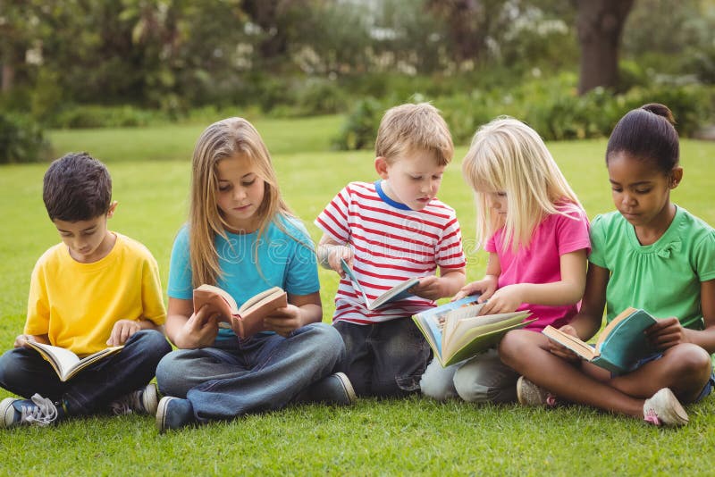 Classmates Sitting in Grass and Reading Books Stock Image - Image of ...