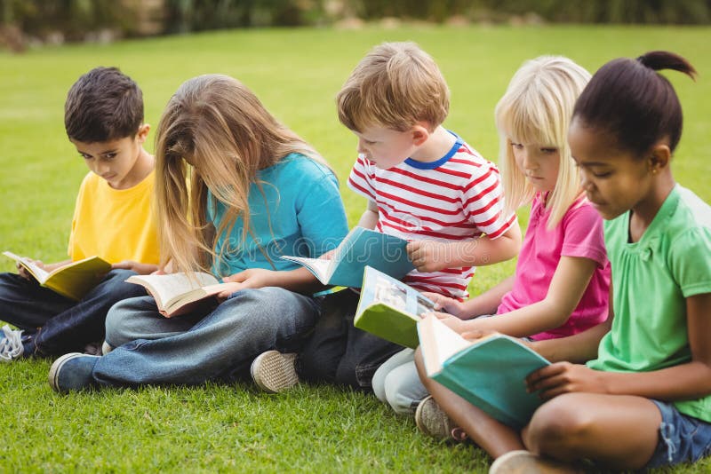 Classmates Sitting in Grass and Reading Books Stock Image - Image of ...