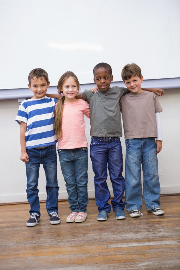 Classmates Smiling at Camera in Classroom Stock Image - Image of early ...
