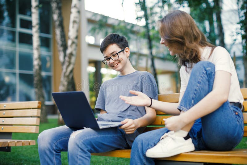 Classmates Talking on a Bench of the School Yard Stock Image - Image of ...