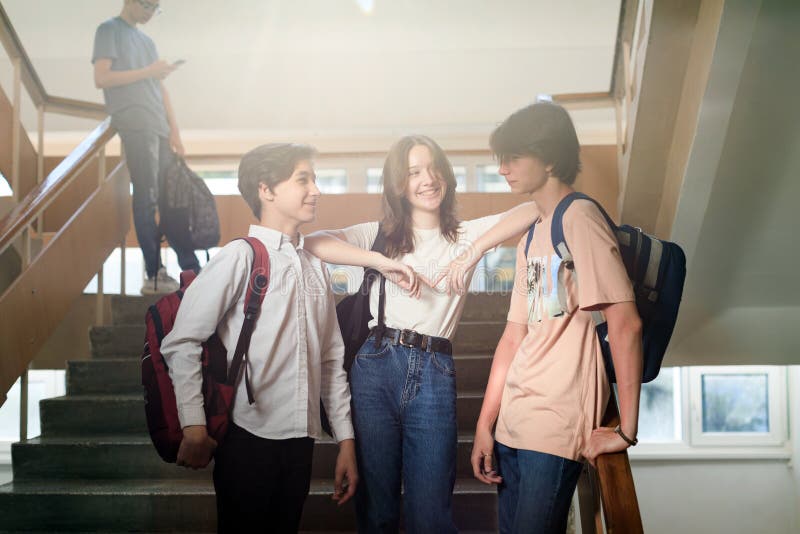 Classmates Talking on a Bench of the School Yard Stock Photo - Image of ...