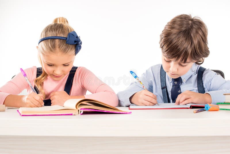 Classmates Writing Homework in Notebooks Stock Photo - Image of ...